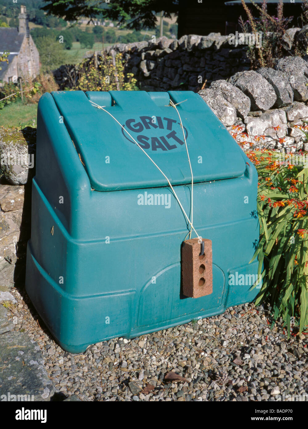 Moulded plastic road grit and salt bin beside a country lane ...