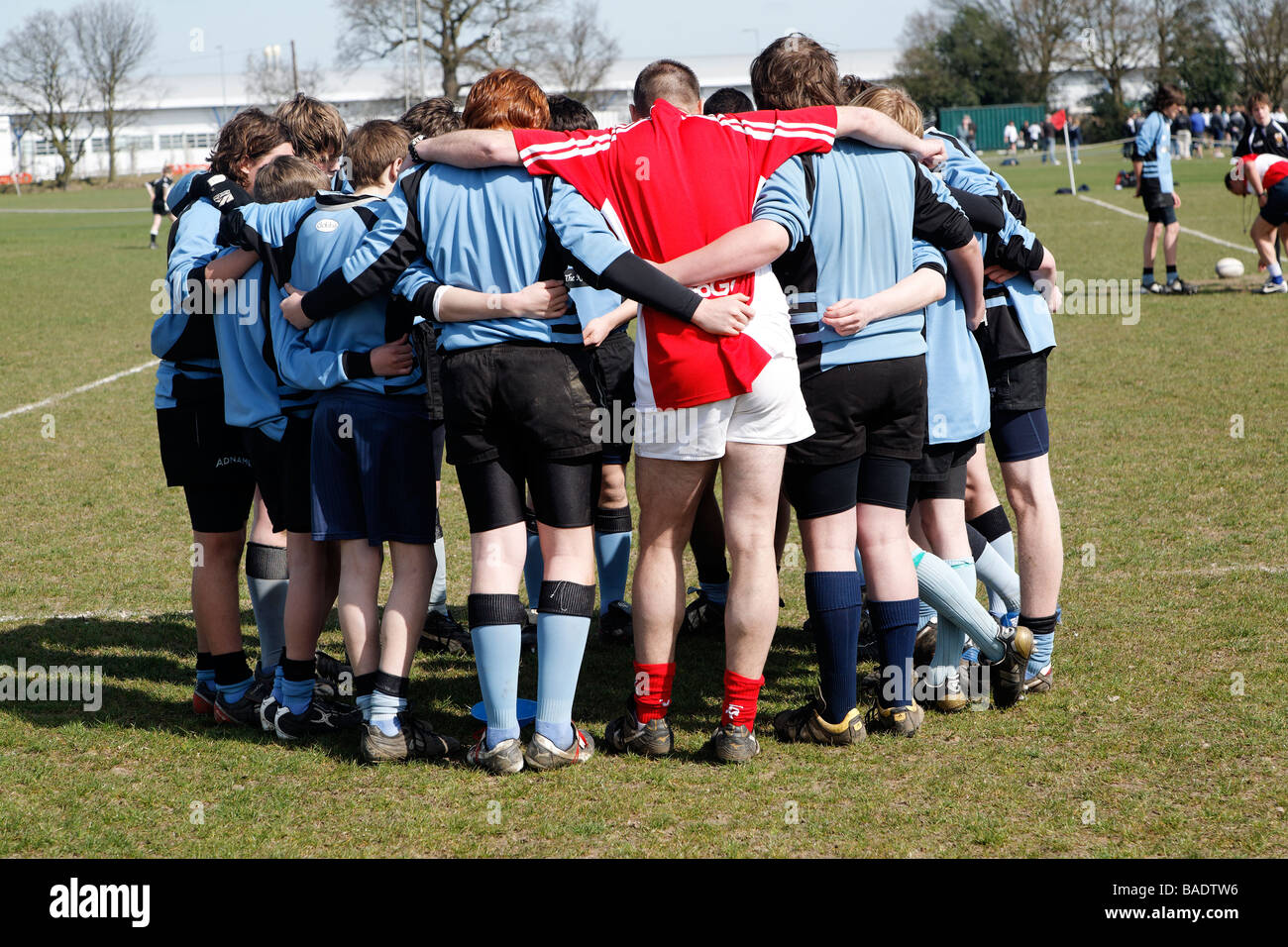 Boys rugby team group huddle before the match Stock Photo - Alamy