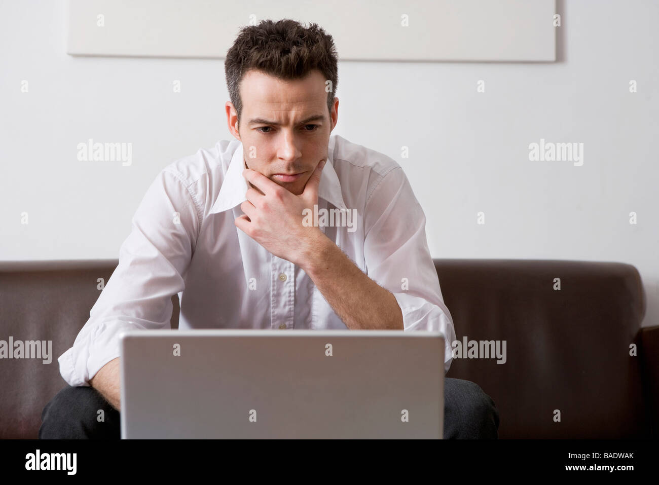 man working at laptop Stock Photo - Alamy