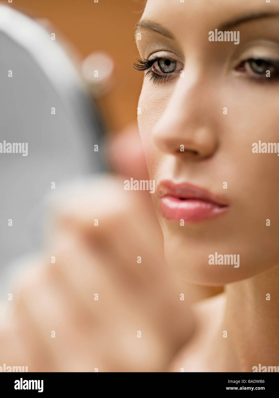 woman with hand mirror Stock Photo - Alamy