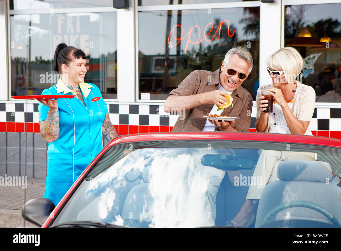 Waitress Serving Couple in Their Convertible at a Retro Diner, Niagara ...