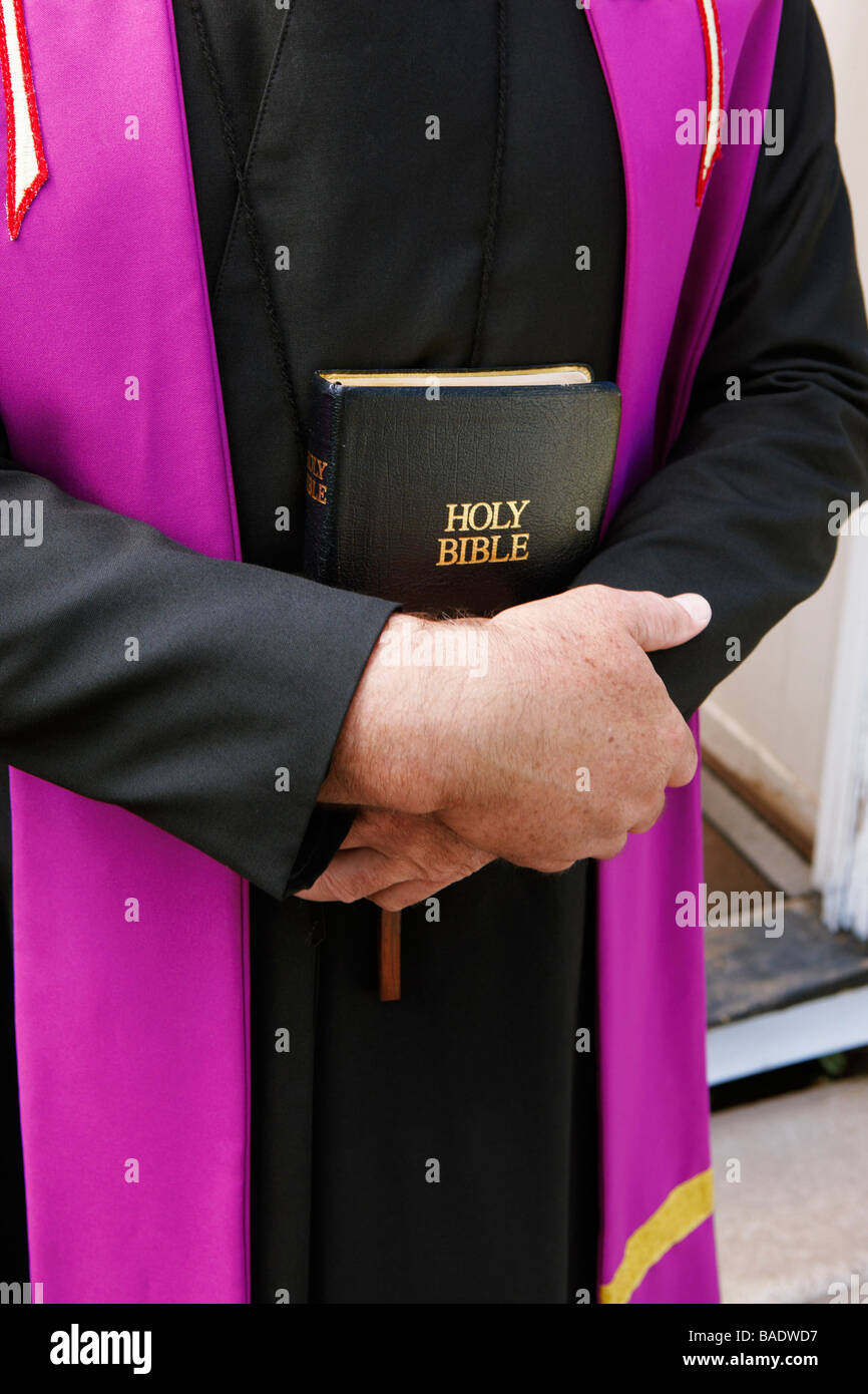 Close-up of Priest Holding Bible Stock Photo - Alamy