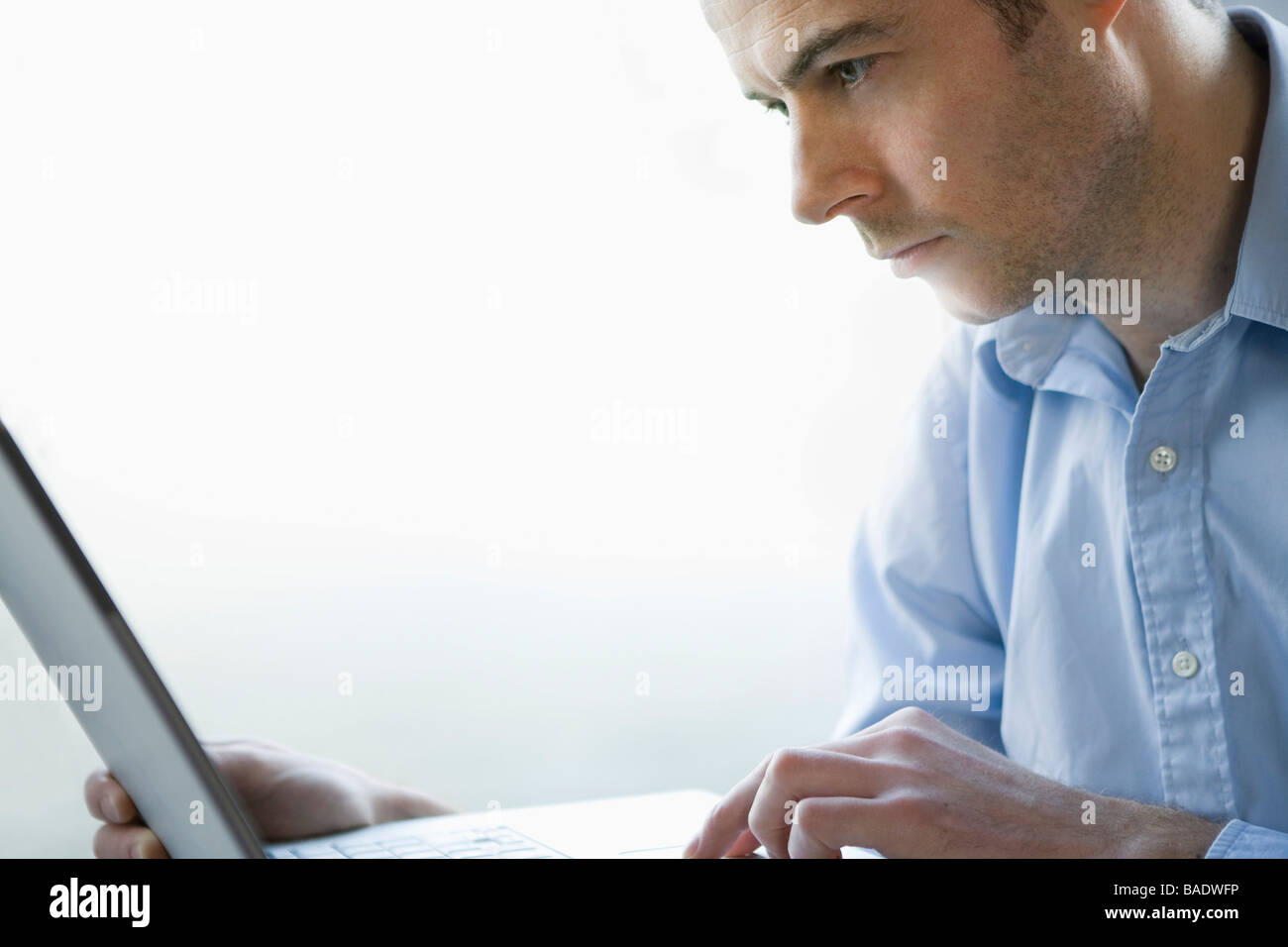 man staring at laptop screen Stock Photo - Alamy