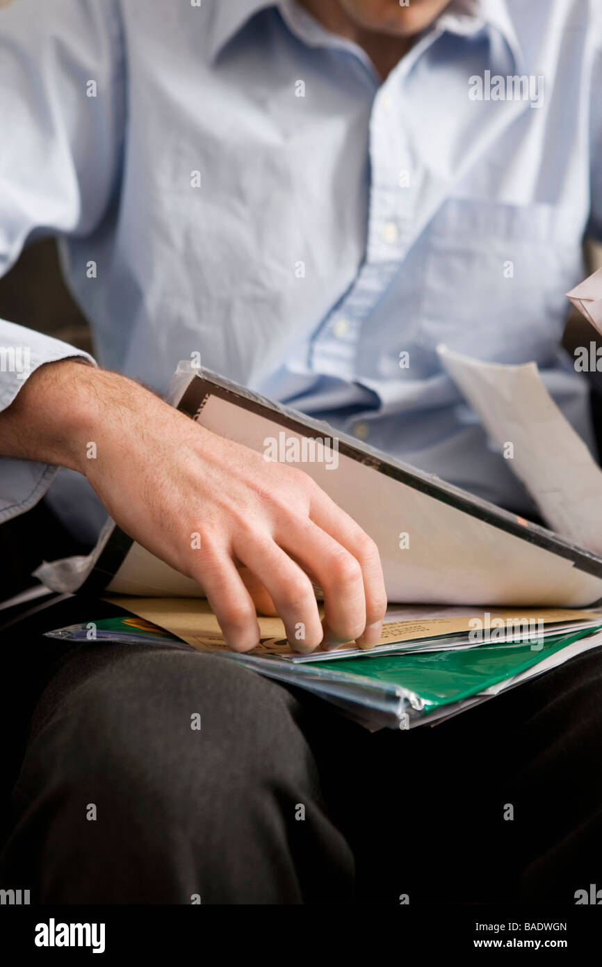 man sorting through mail Stock Photo - Alamy