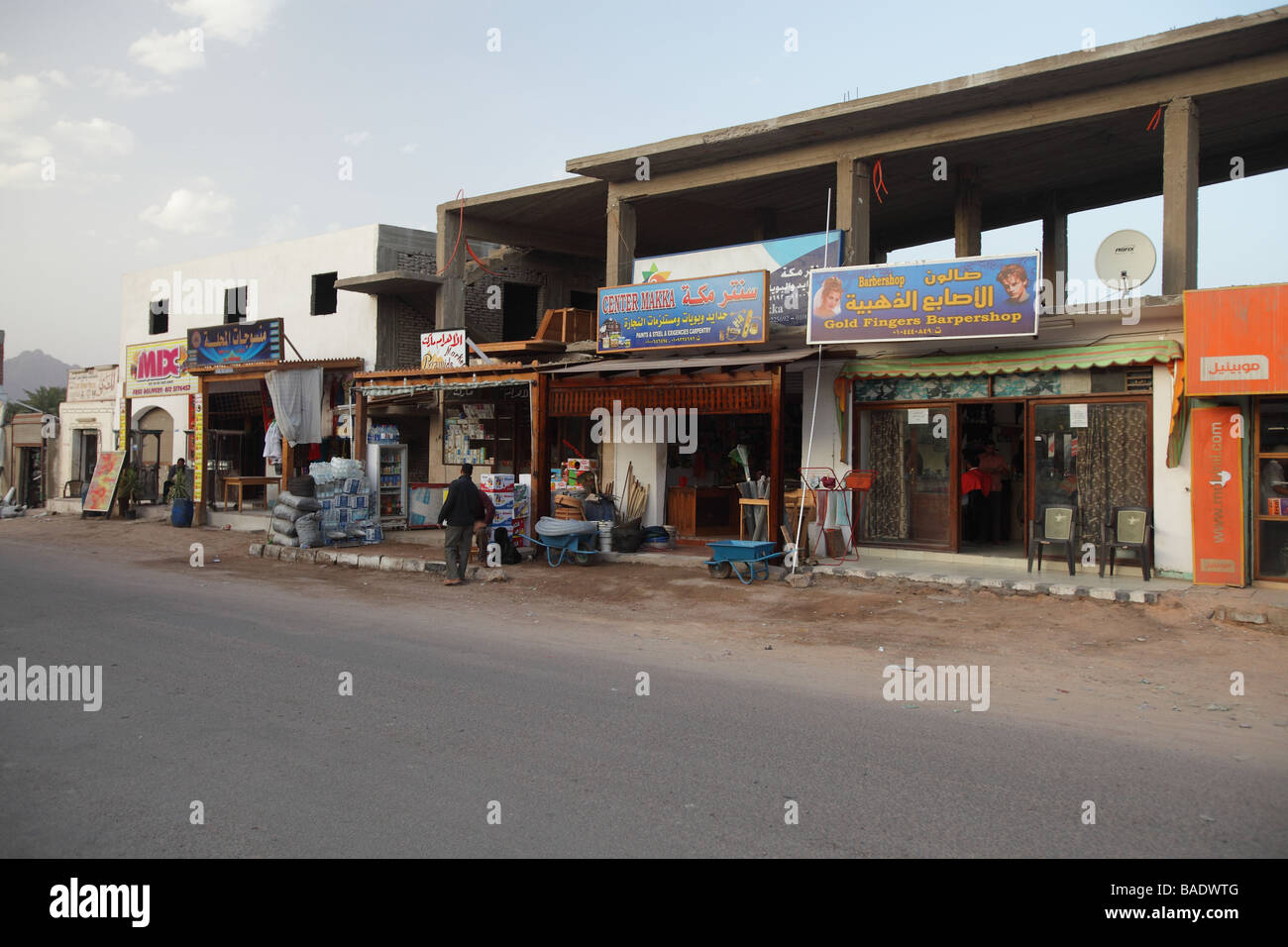 Street scene in Dahab Egypt showing typical shop fronts from the old to ...
