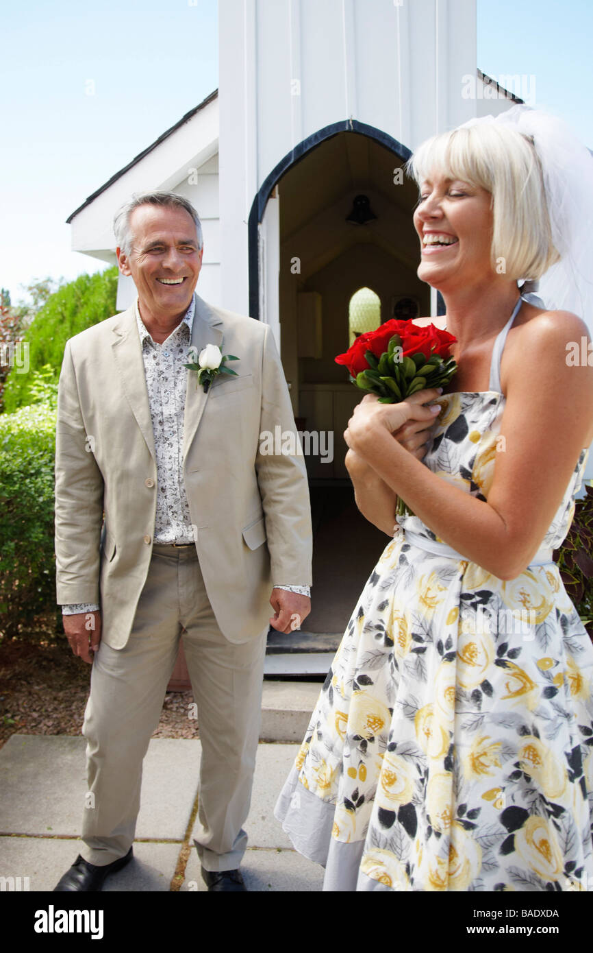 Couple Standing Outside Wedding Chapel Stock Photo - Alamy