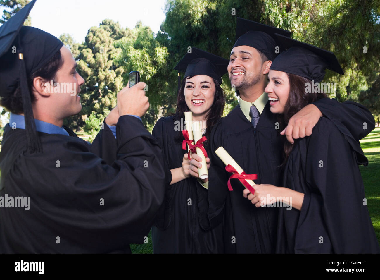Male college graduate posing outdoors hi-res stock photography and ...