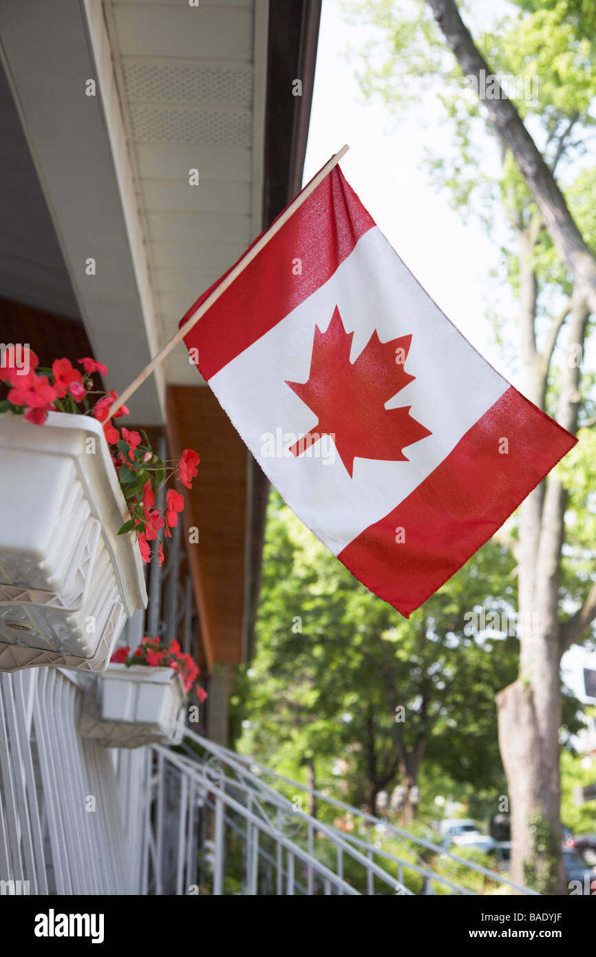 Canadian Flag Flying From Porch Stock Photo - Alamy