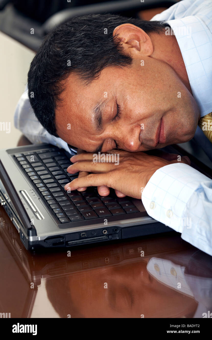 business man sleeping on his laptop computer at the office Stock Photo ...