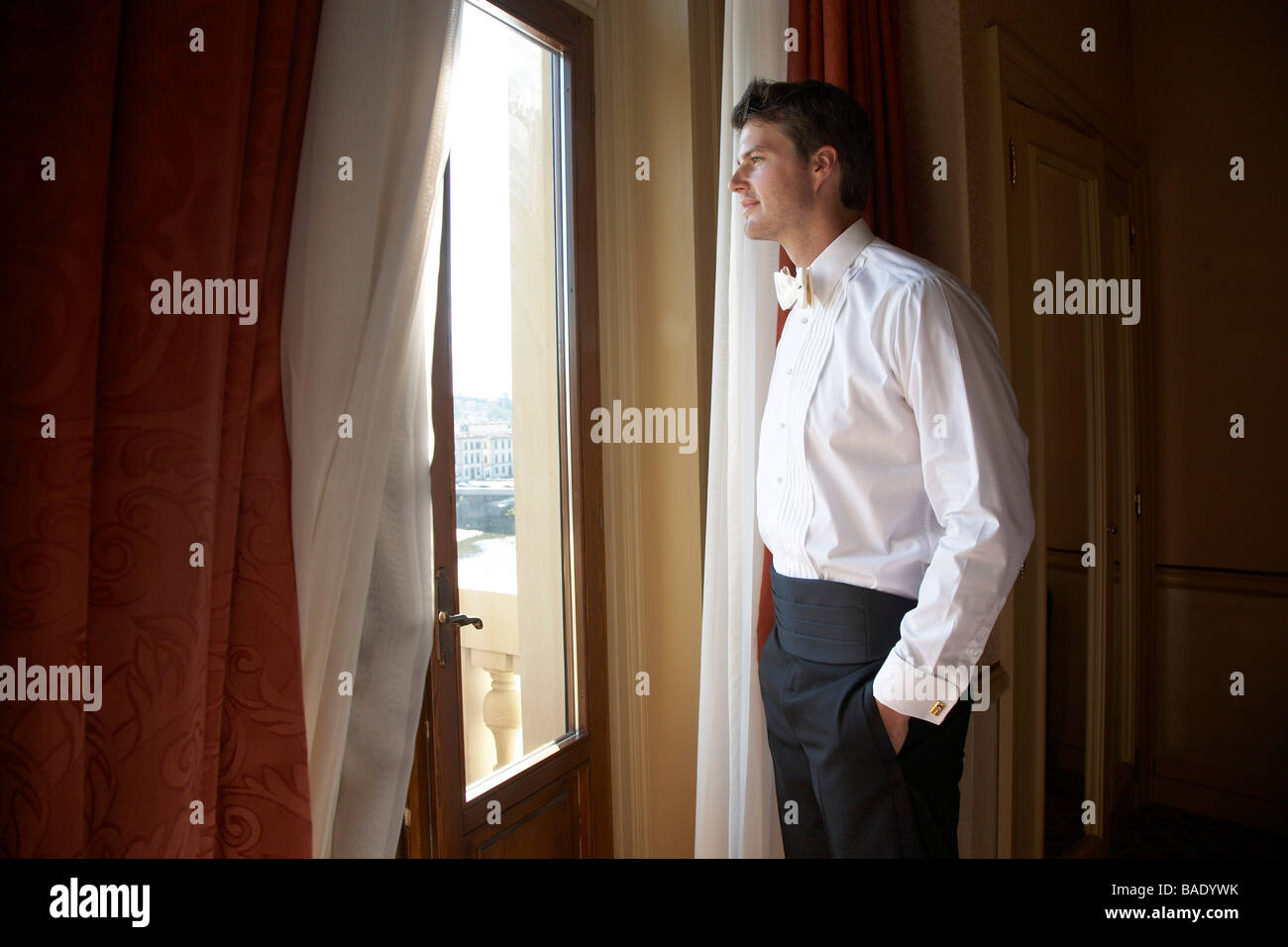 Evening wear looking out window hi-res stock photography and images - Alamy