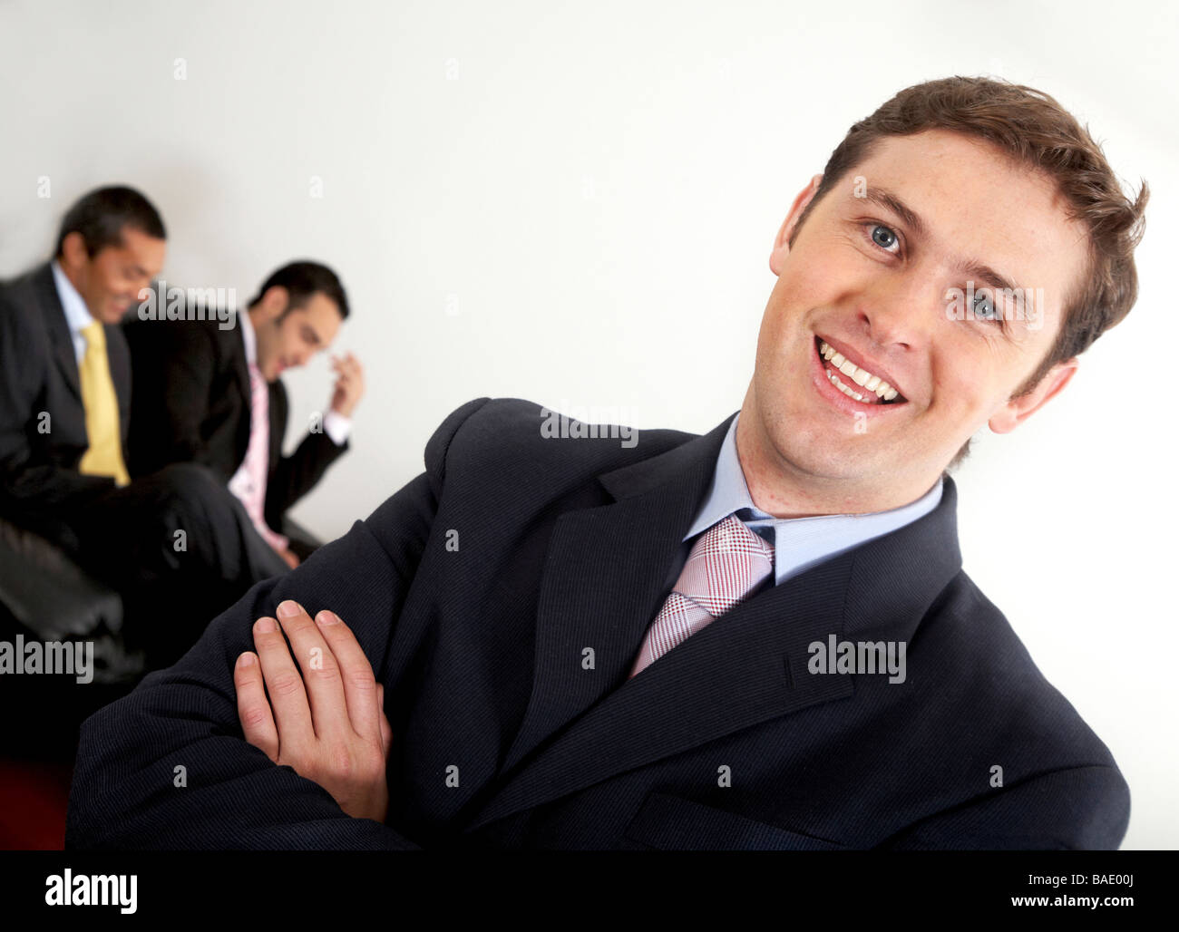 confident european business man in an office with some businesspeople ...