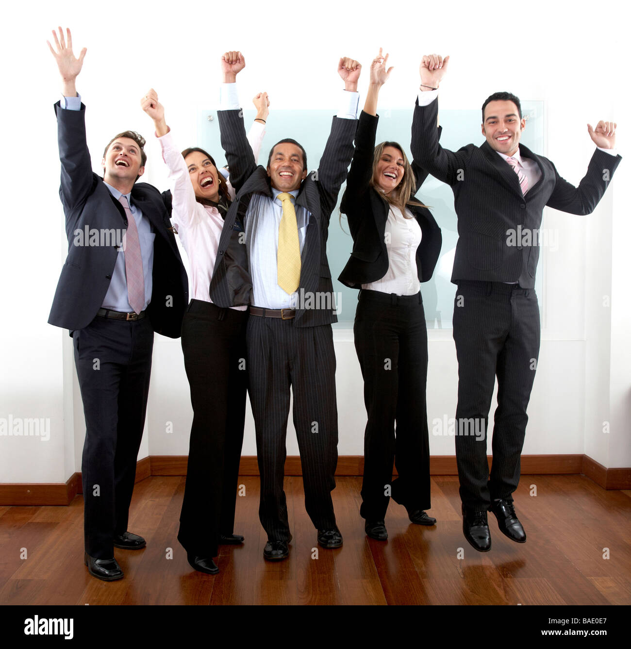 business team jumping of success at the office Stock Photo - Alamy