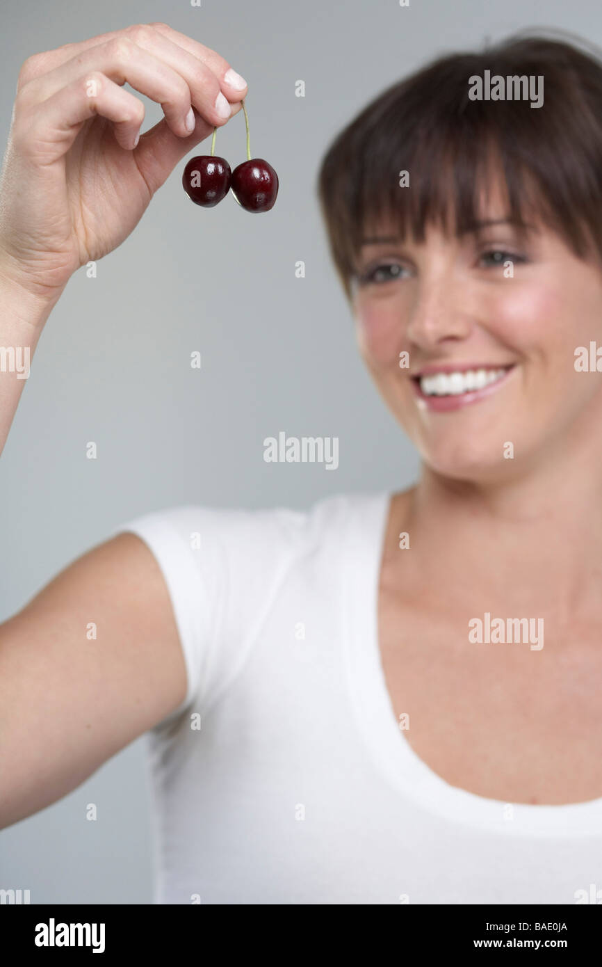 Woman Holding Cherries Stock Photo - Alamy