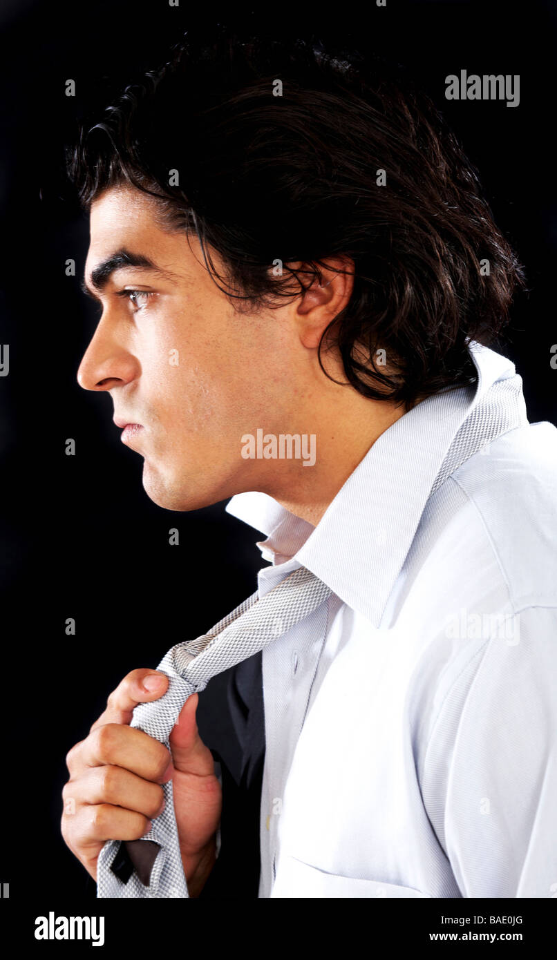 business man getting ready for an interview over a black background ...