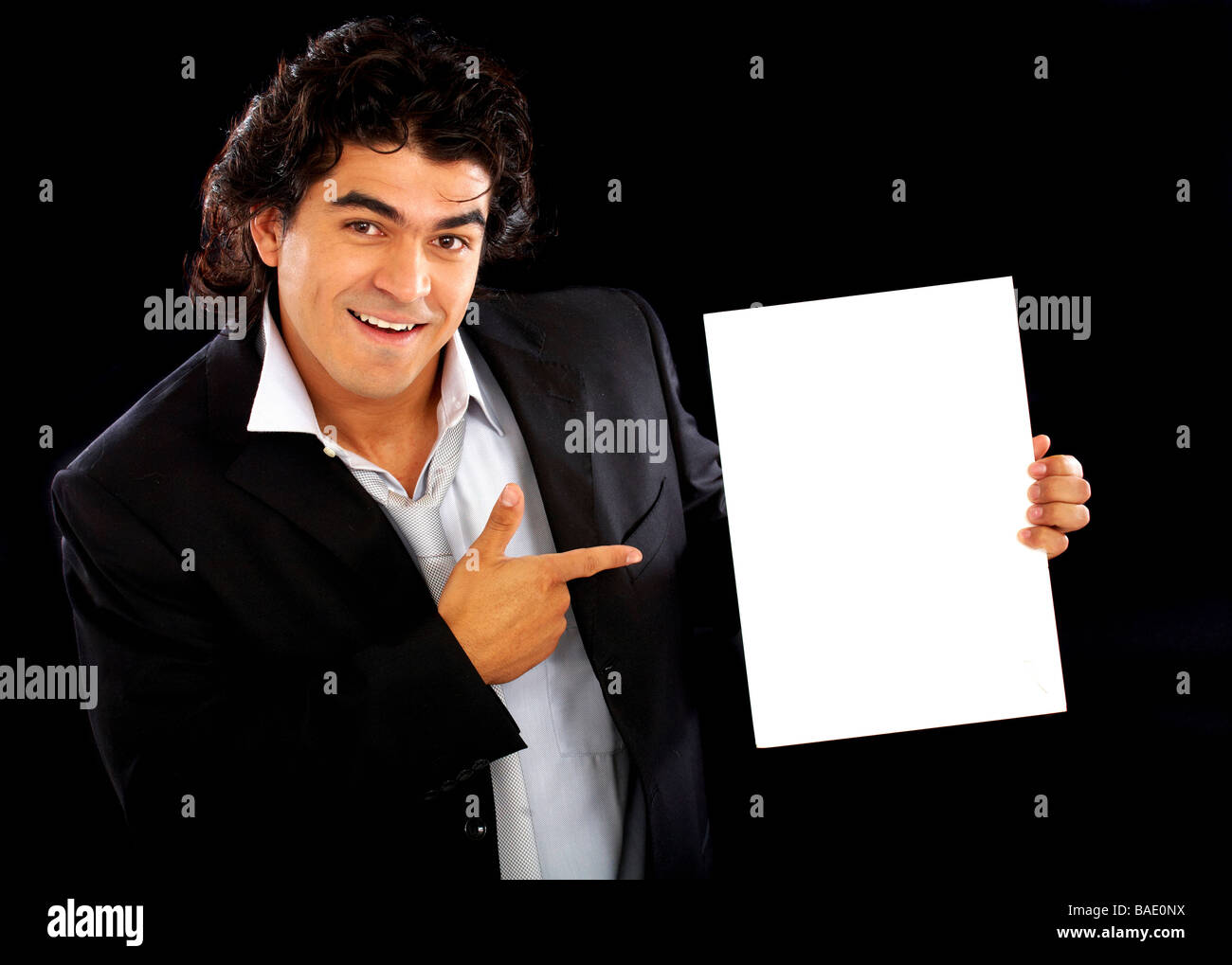 business man pointing at a poster over a black background Stock Photo ...
