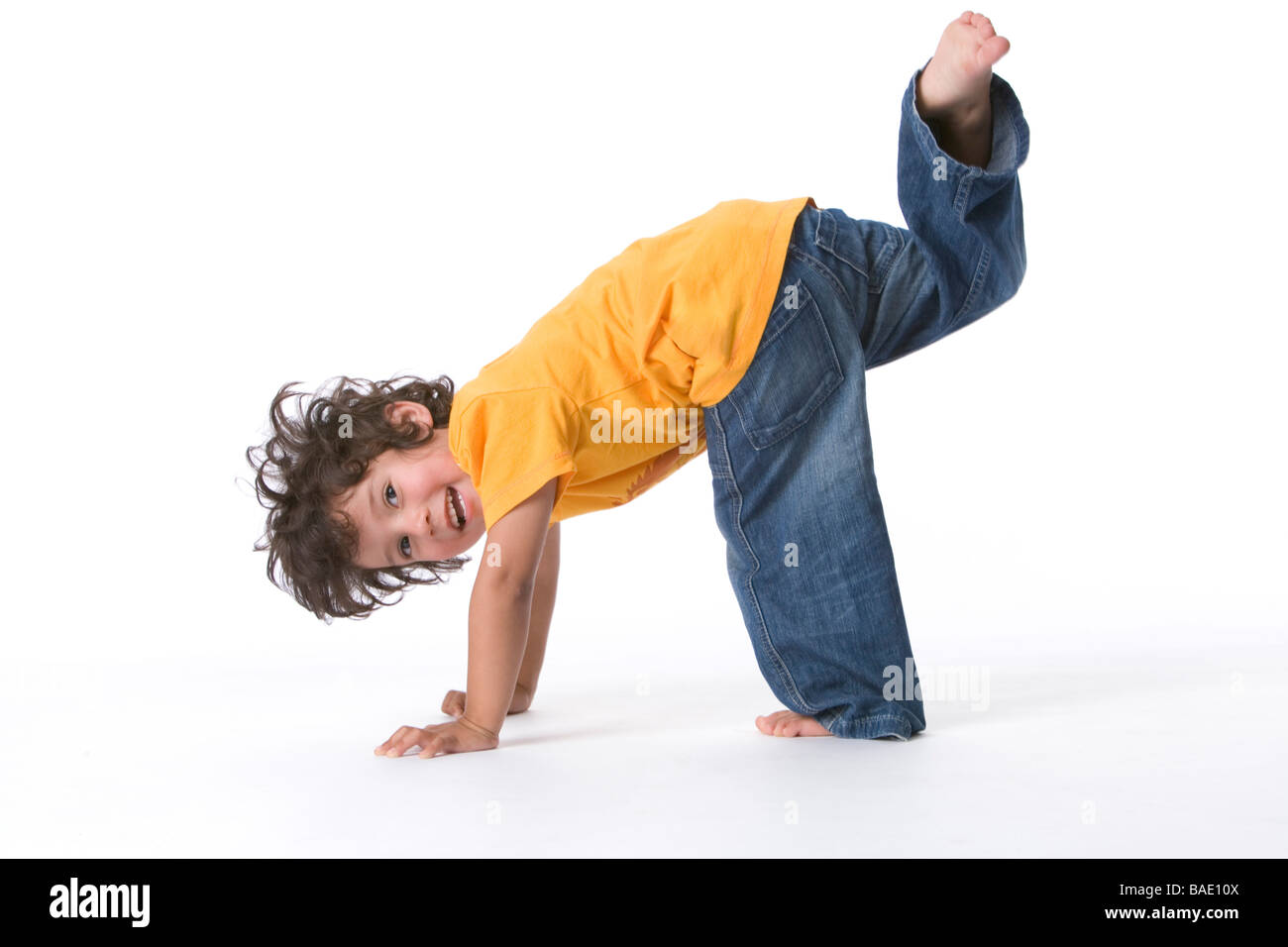 Little boy standing on hands and one foot Stock Photo - Alamy
