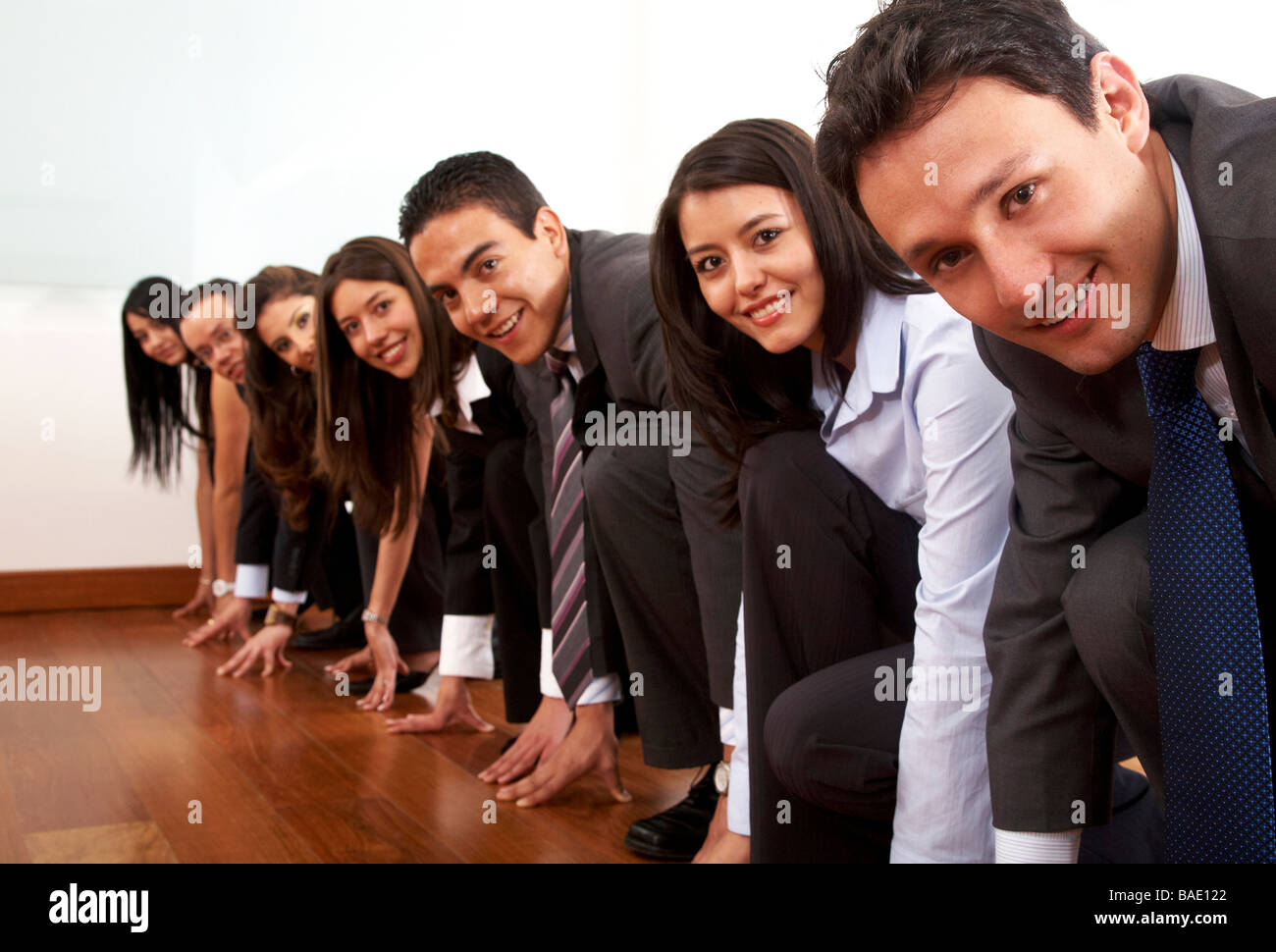 competitive business people in an office lining up for a race Stock ...