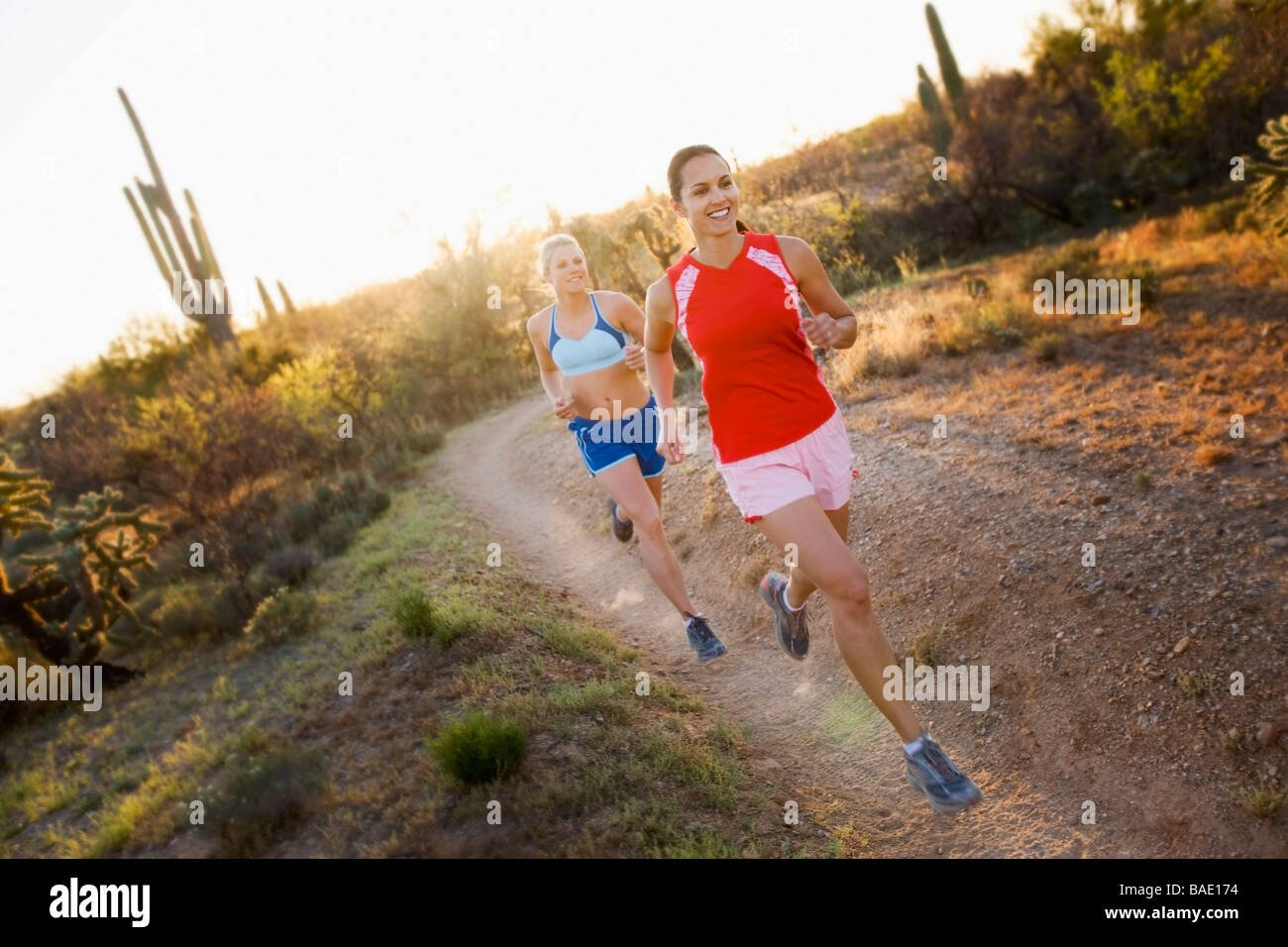 Women Running on Desert Trail, Saguaro National Park, Arizona, USA ...