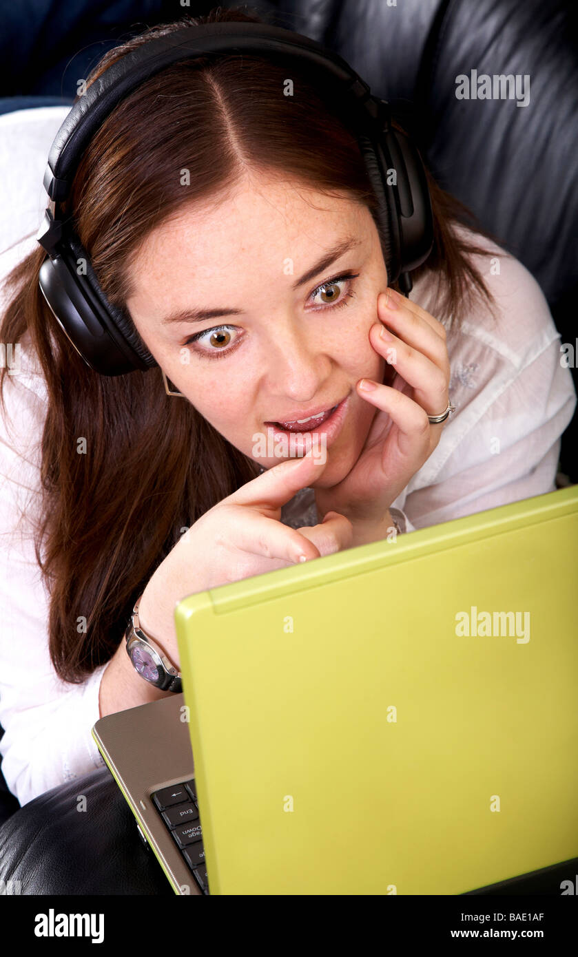 girl looking surprised while browsing the internet Stock Photo - Alamy