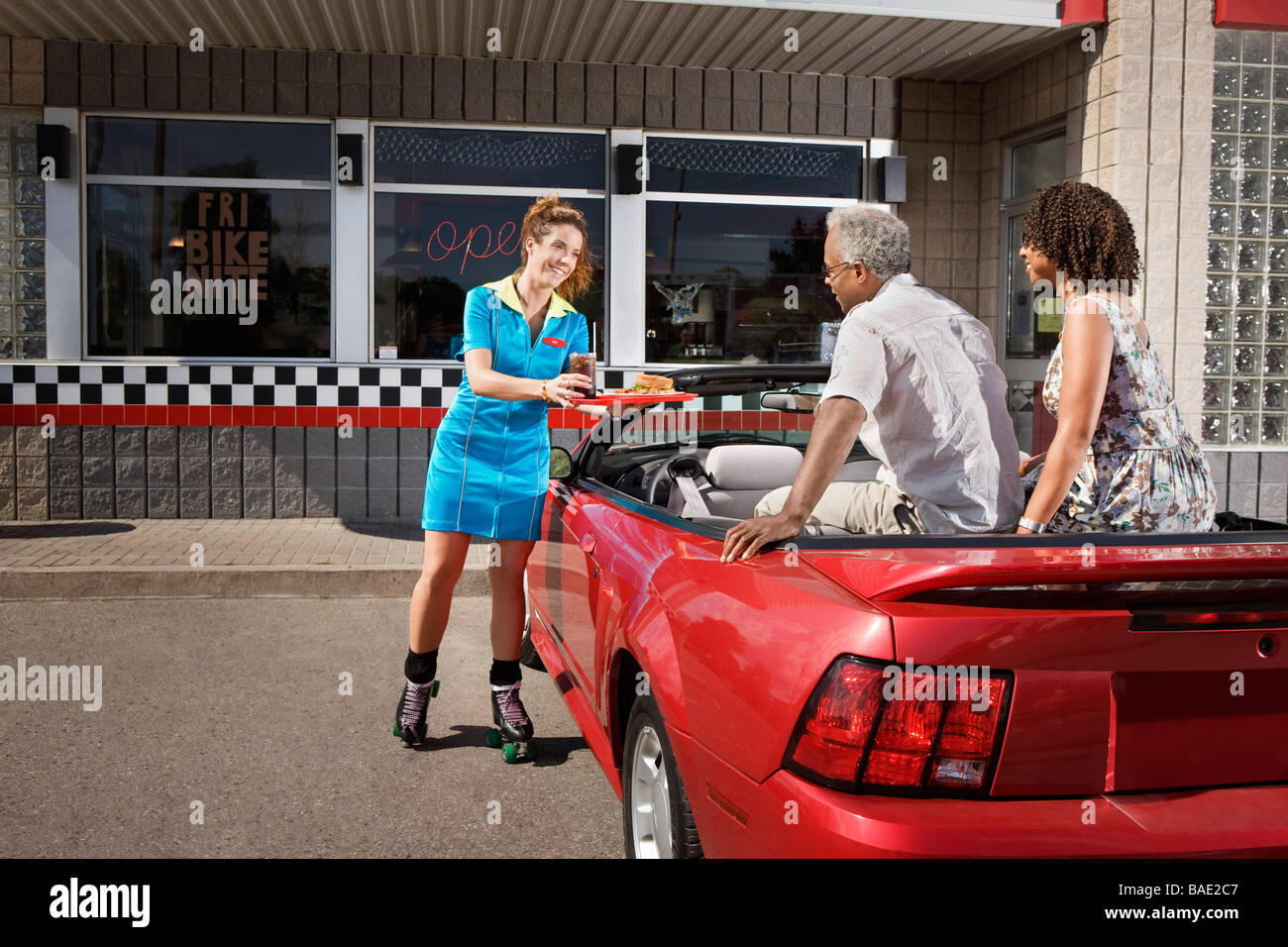 Waitress in blue uniform hi-res stock photography and images - Alamy