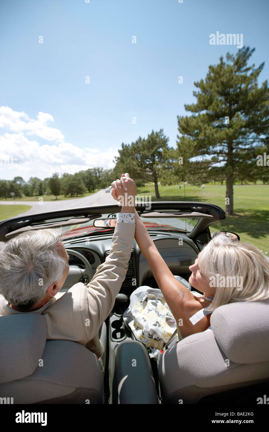 Excited Couple in Convertible Stock Photo - Alamy