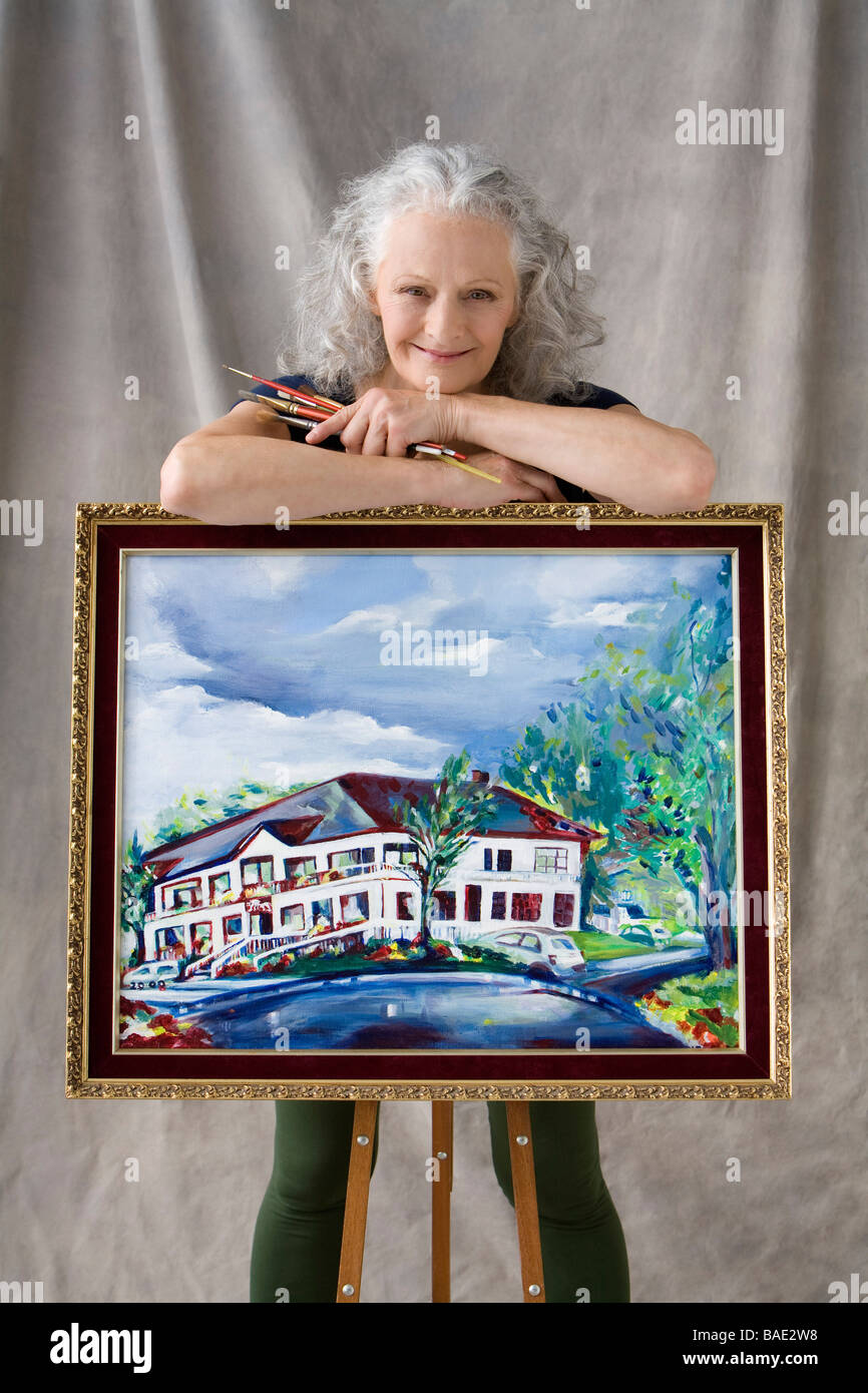 Woman Posing with Painting Stock Photo - Alamy