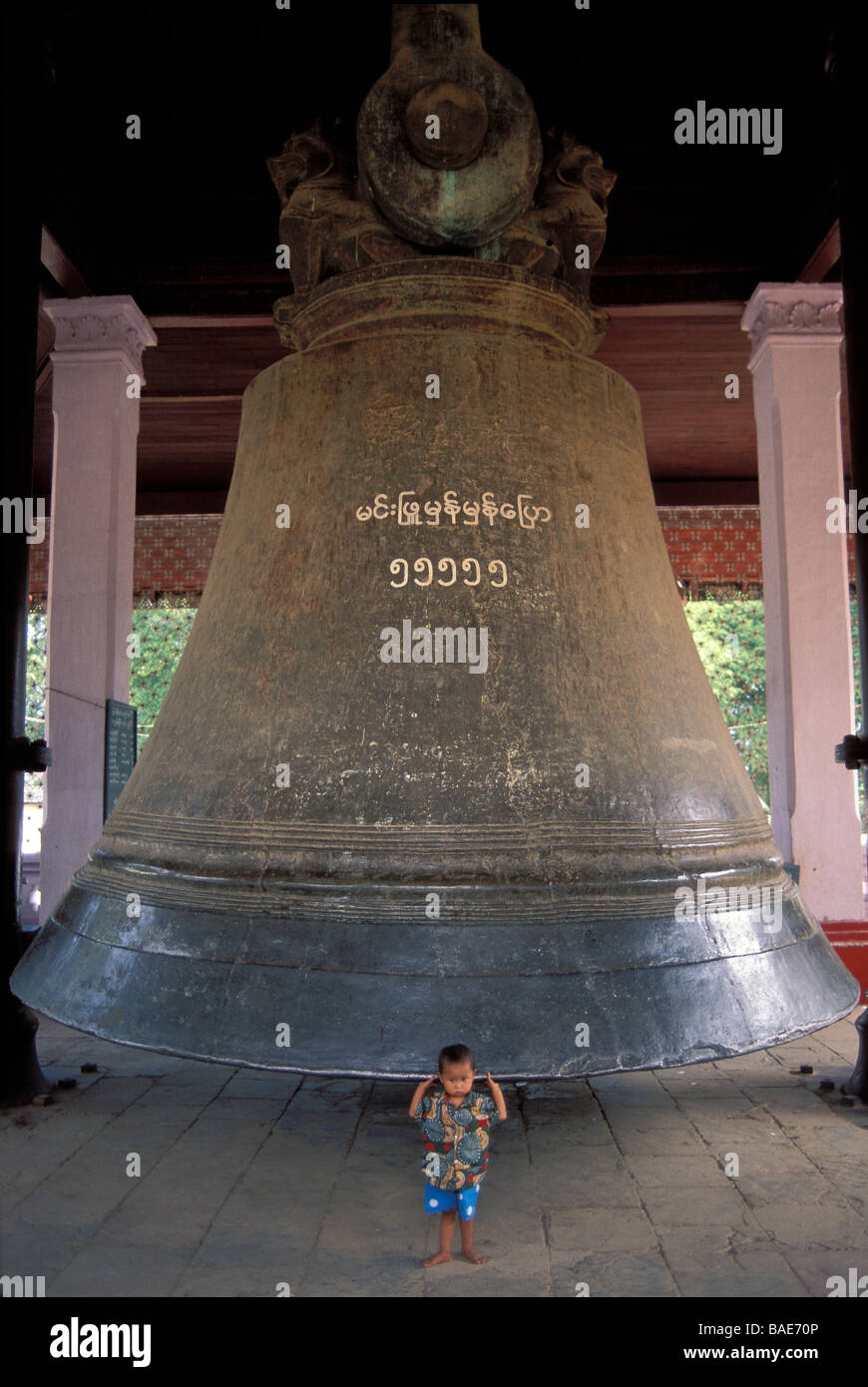 Myanmar (Burma), Sagaing Division, Mingun, child in front of the big ...