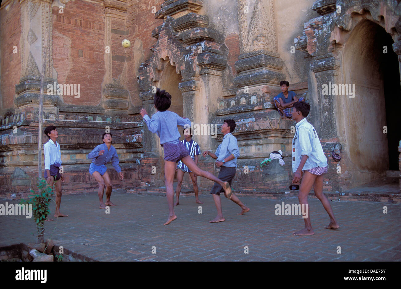 Myanmar (Burma), Mandalay Division, Bagan, Htilominlo Pagoda, children playing chinlon ...