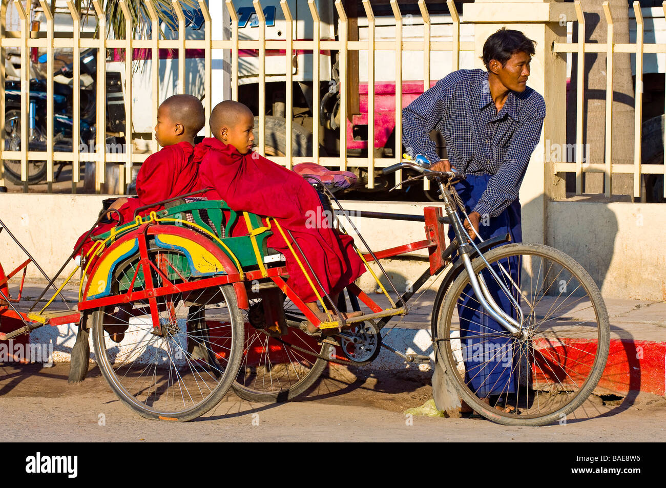 Myanmar (Burma), Mandalay Division, Mandalay, rickshaw in the middle of ...