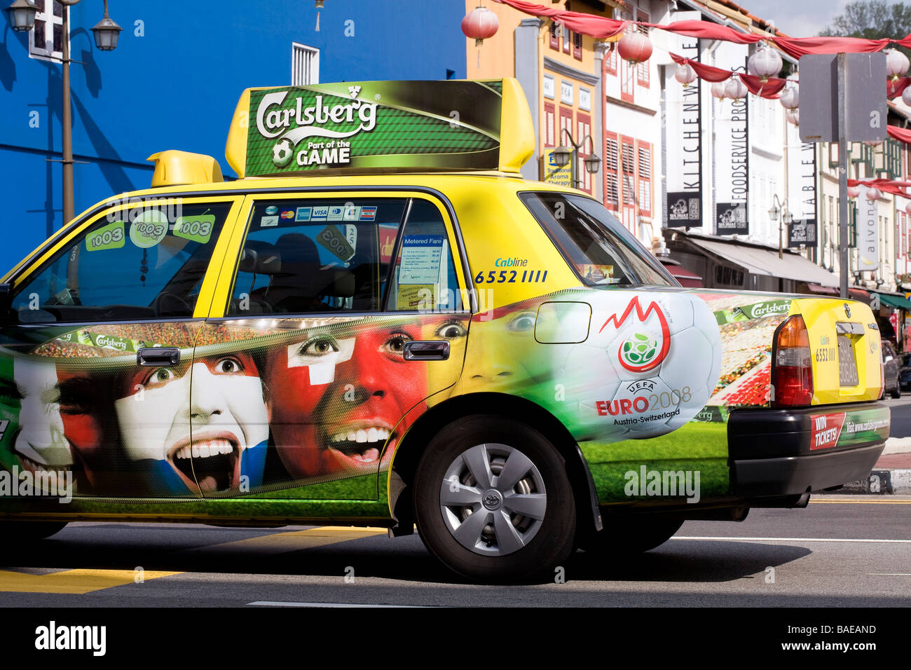 Singapore, Chinatown, with bus advertising for the Euro 2008 Stock ...