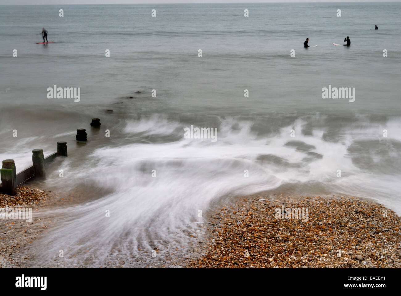 Surfers waiting for waves at Bracklesham Bay west sussex England UK ...