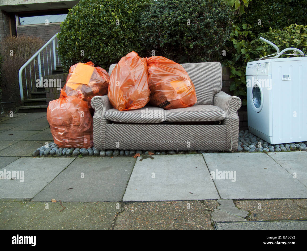Discarded couch on the street Stock Photo - Alamy