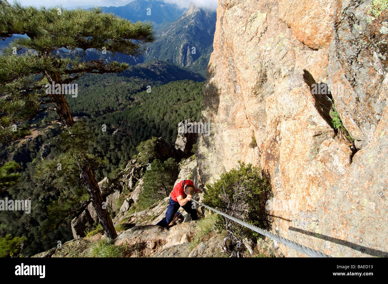 France, Corse du Sud, Bavella, a huge cliff hole equipped with a via ...