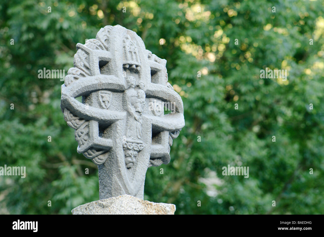 Stone cross in front of the Santa Maria romanic church in Ribera de ...
