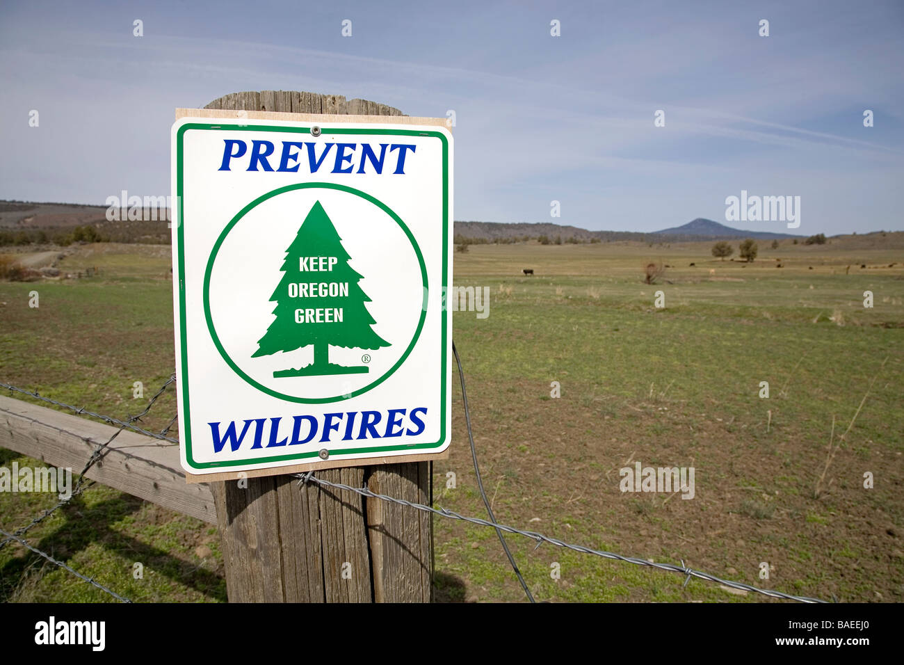 A Prevent Wildfires sign on a fencepost says Keep Oregon Green Stock ...