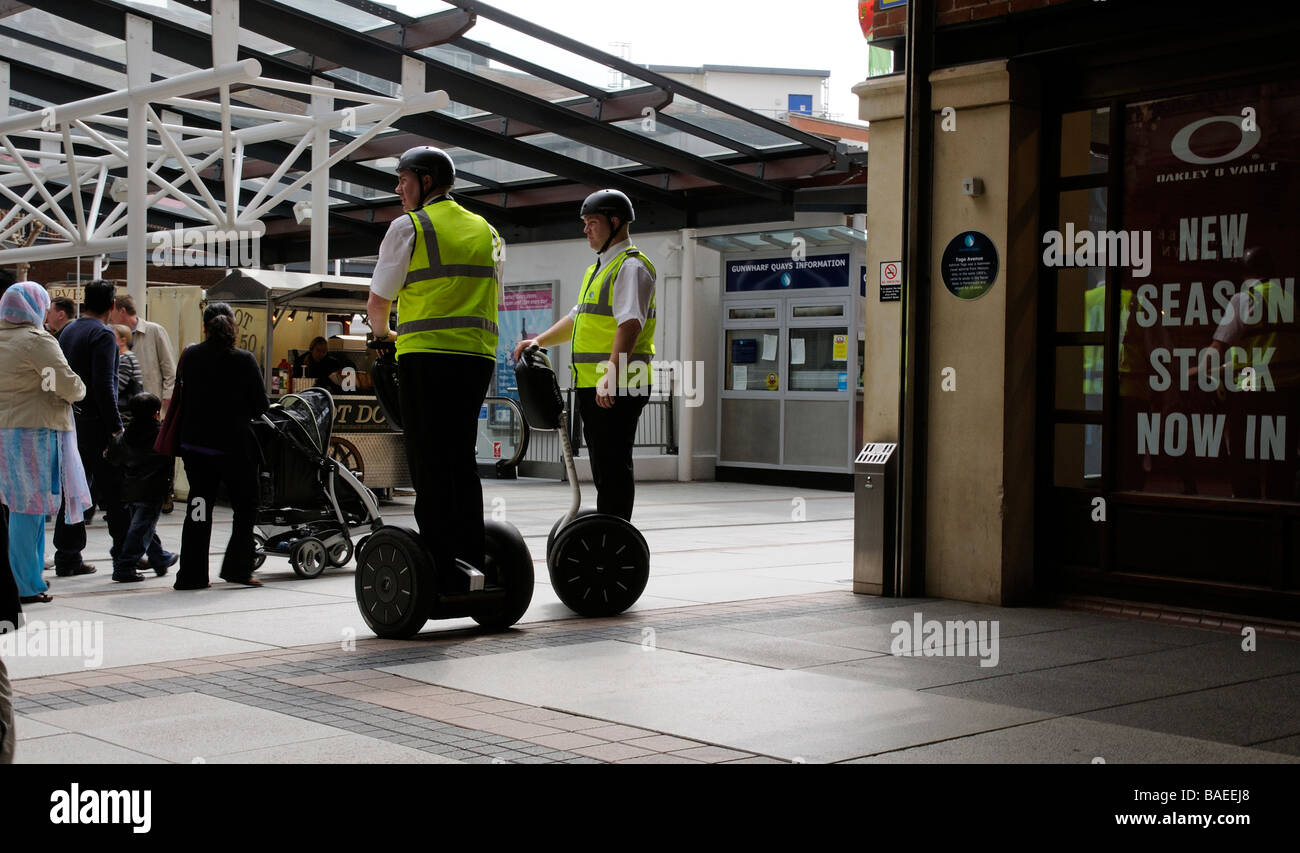 Security patrol officers standing on their electric two wheeled ...