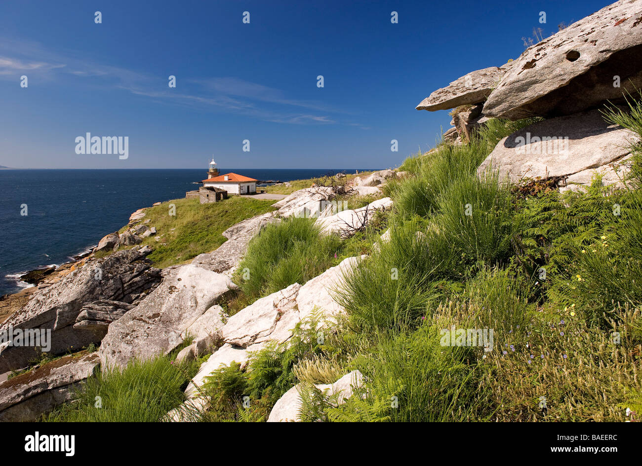 Spain, Galicia, Costa da Muerte, Punta Louro and lighthouse Stock Photo ...