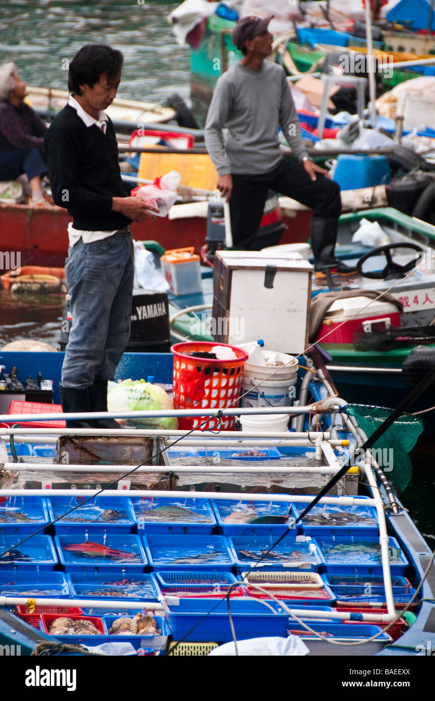 Fisherman selling the catch of the day Stock Photo - Alamy