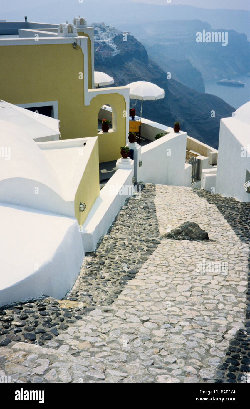 cobbled steps with cliffs of Thira in the distance Santorini, Cyclades ...