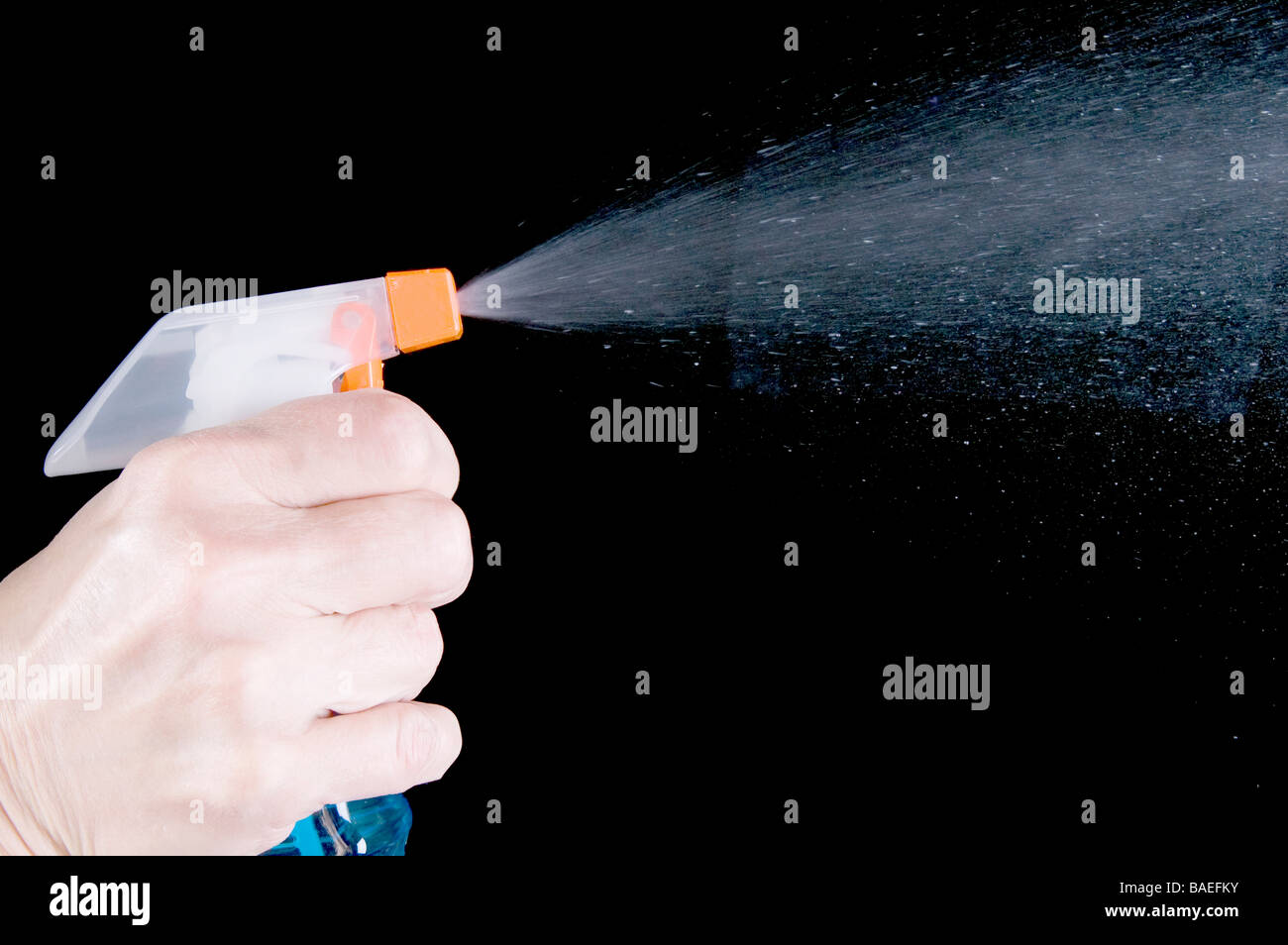 object on black spray bottle close up Stock Photo - Alamy