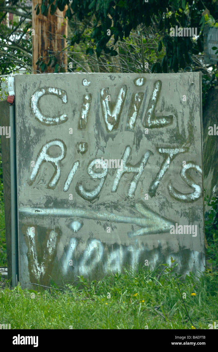 Hand painted sign pointing out civil rights violation Stock Photo - Alamy