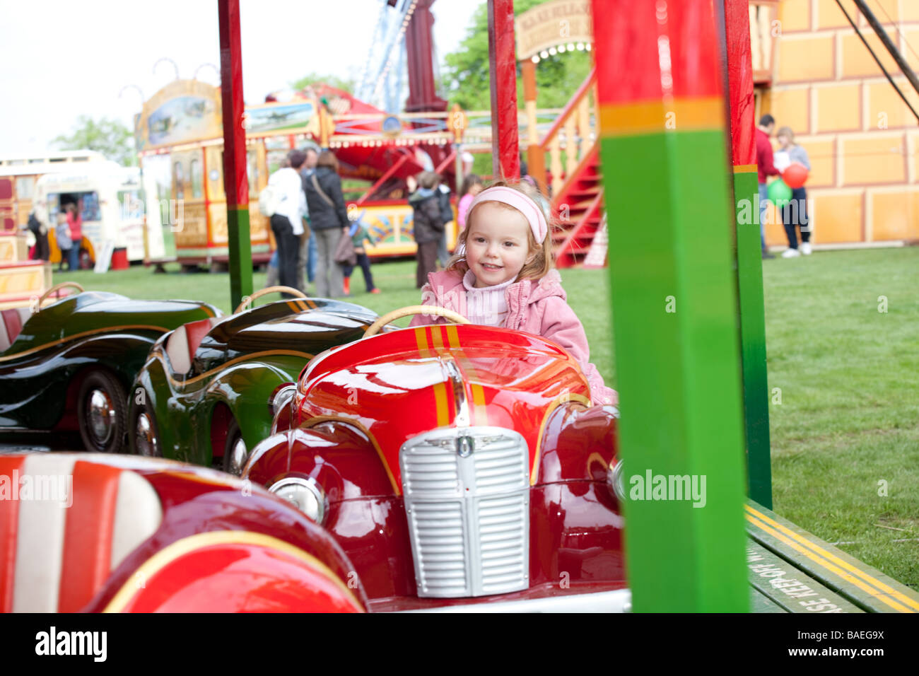 Girl on a ride at the funfair Stock Photo - Alamy