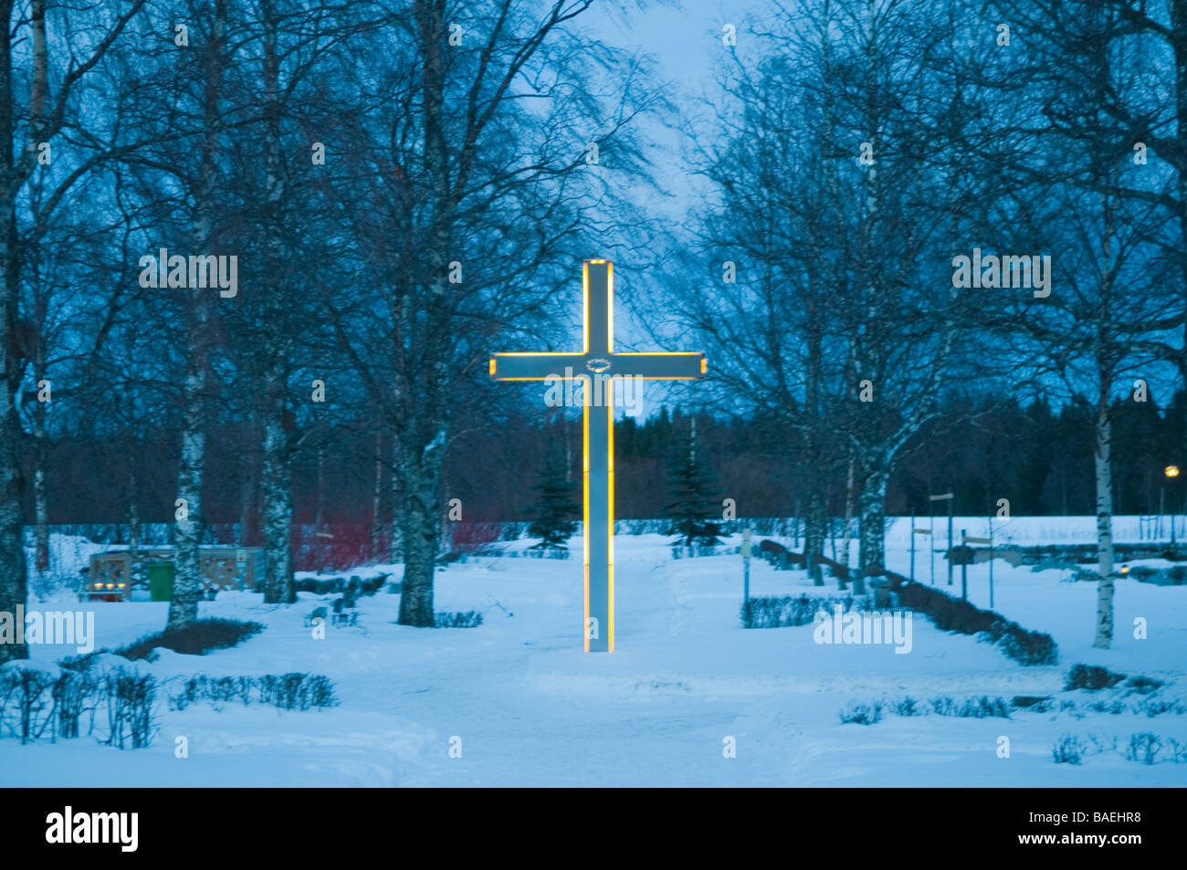 Illuminated cross on churchyard Stock Photo - Alamy
