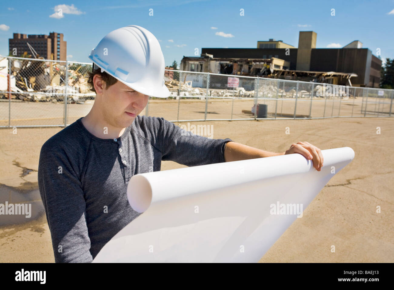 Looking at construction site plans Stock Photo - Alamy