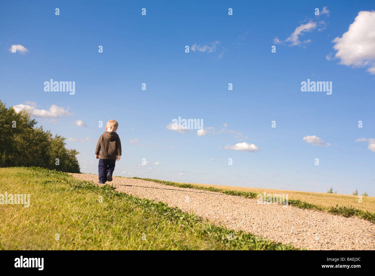 Child walking on a path Stock Photo - Alamy