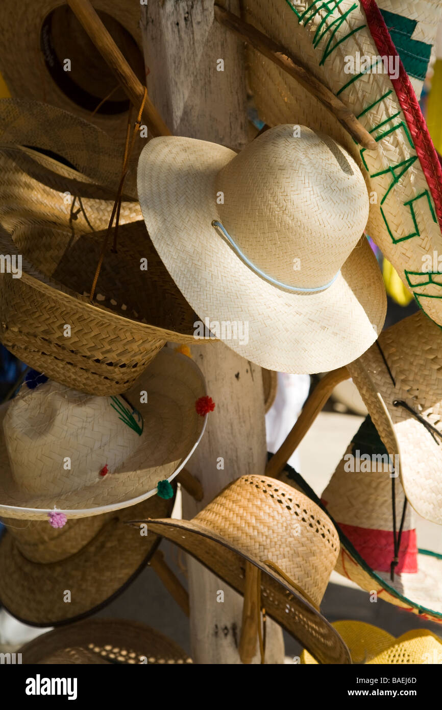 MEXICO Todos Santos Straw hats hanging on display stand in retail store ...