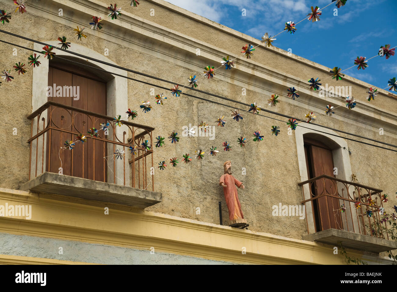 MEXICO Todos Santos Decorations strung on string between buildings in ...