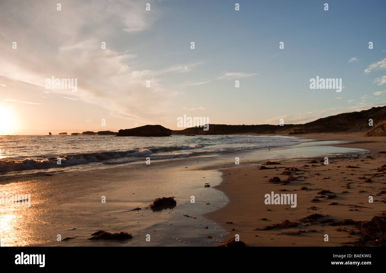 Setting sun on the beach Stock Photo - Alamy
