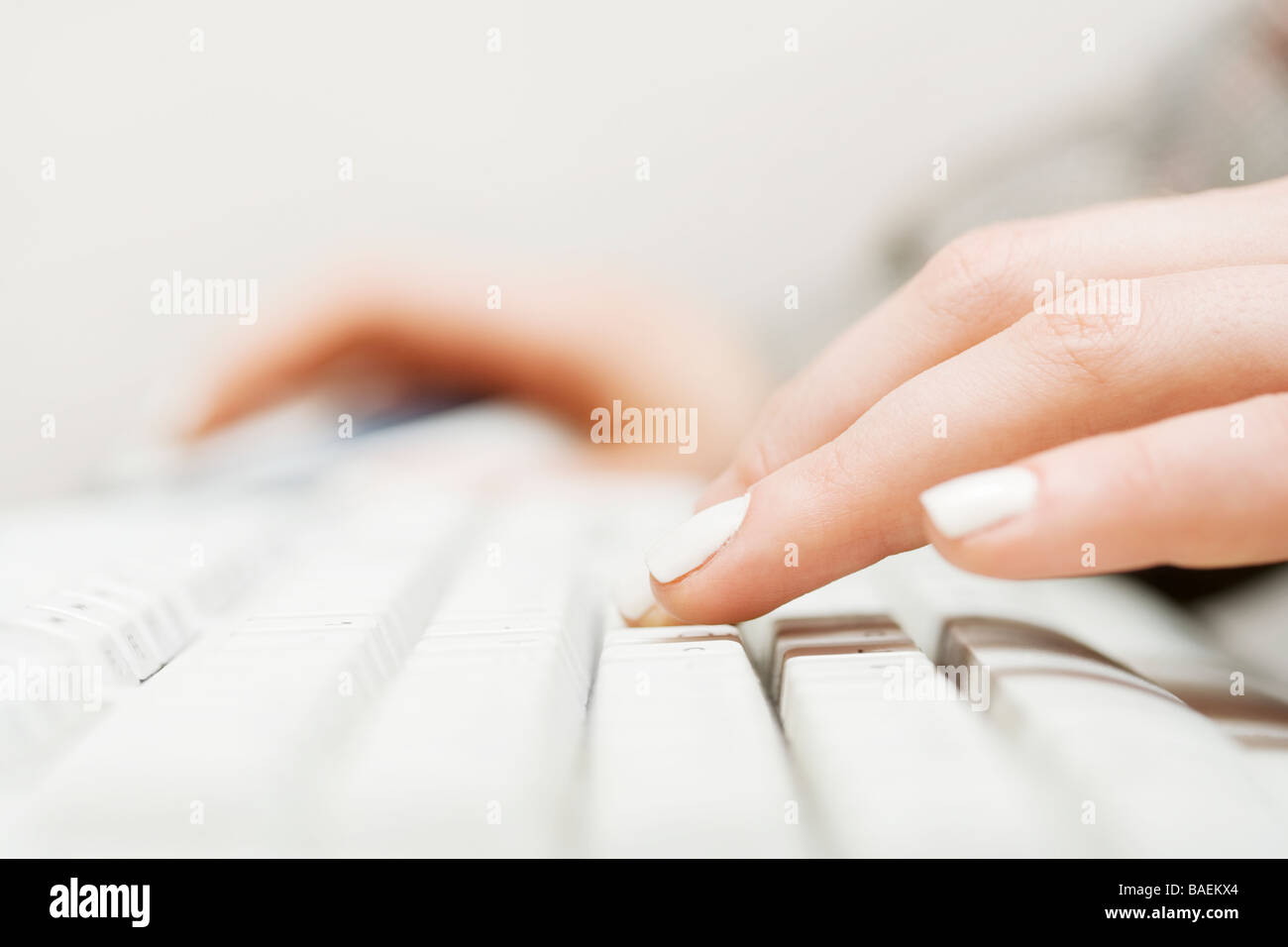 Female hands typing Stock Photo - Alamy