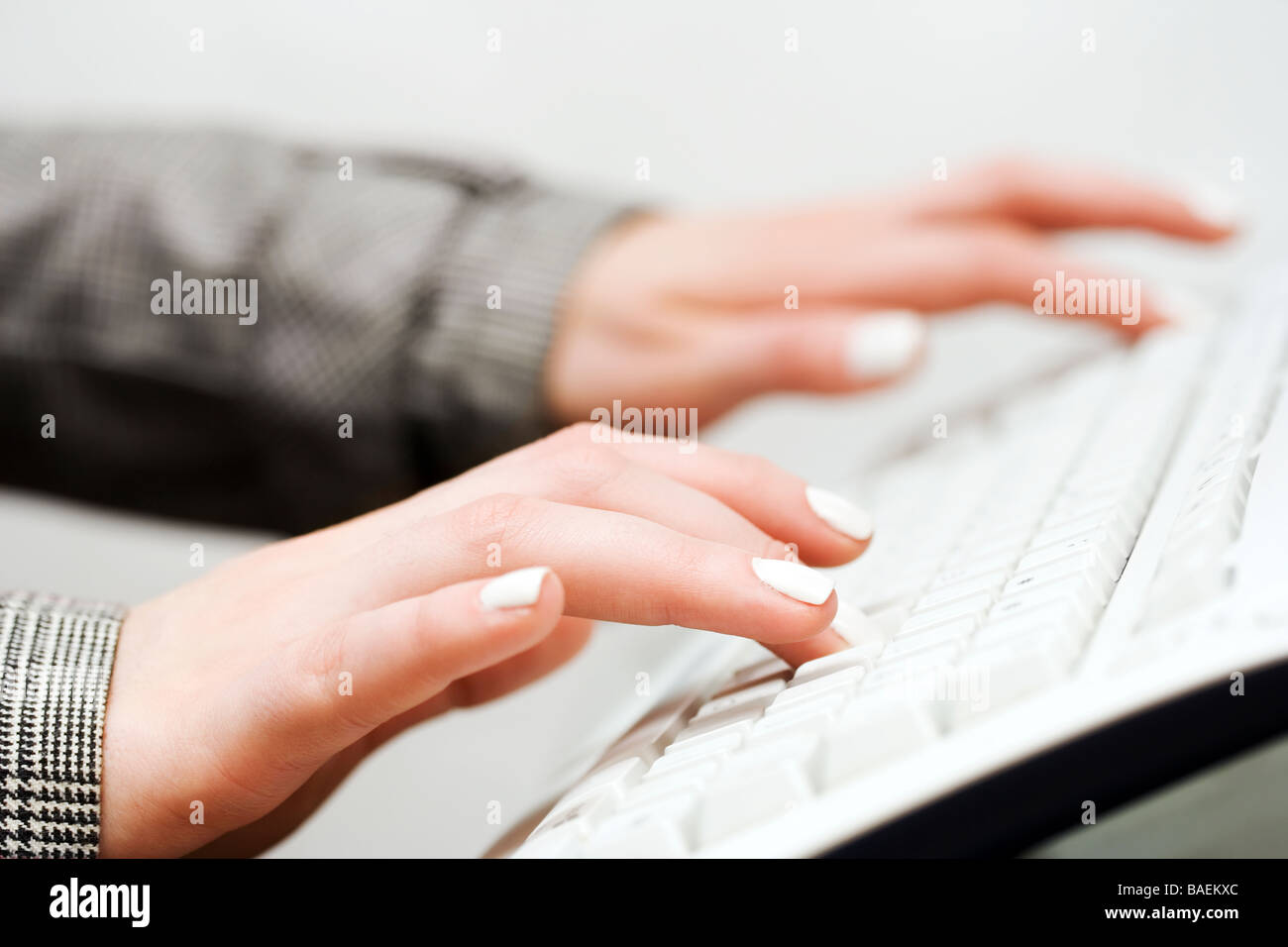 Female hands typing Stock Photo - Alamy